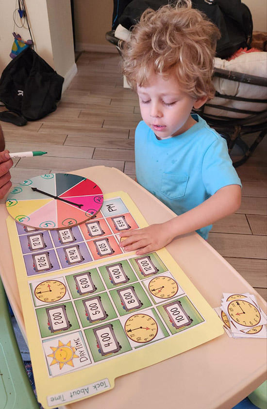 A printable file folder game to help kids tell time by DJ Inkers